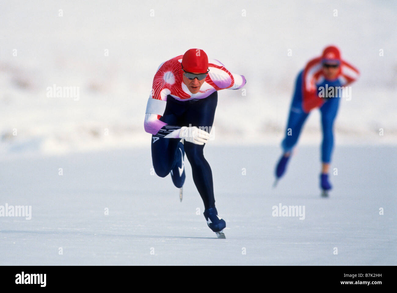 Male speed skaters in action Stock Photo - Alamy