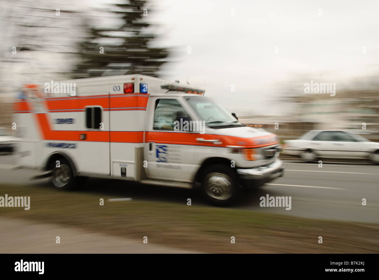 Ambulace speeding to hospital Stock Photo - Alamy
