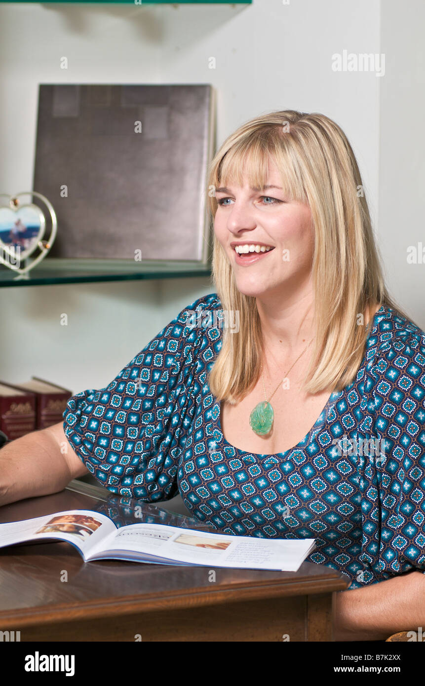 Female writer works at elegant desk Stock Photo - Alamy