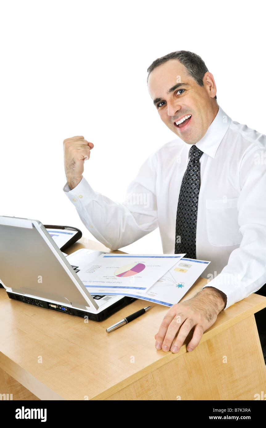 Happy smiling businessman sitting at his desk isolated on white ...