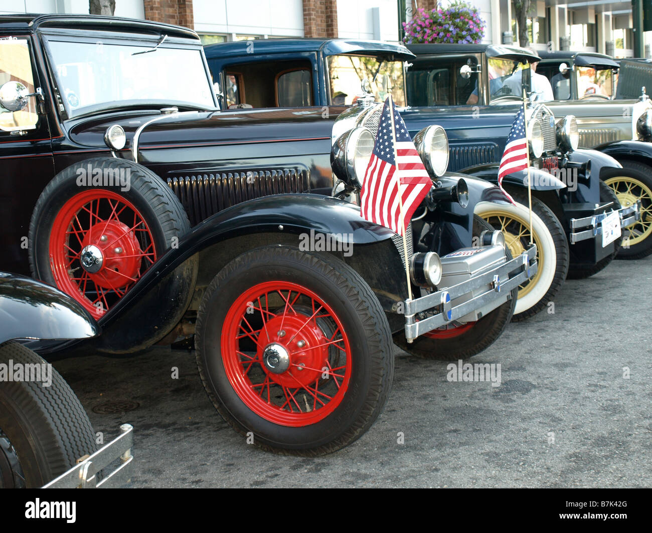 A row of vintage Model T cars at the Woodward Dream Cruise. The cars ...