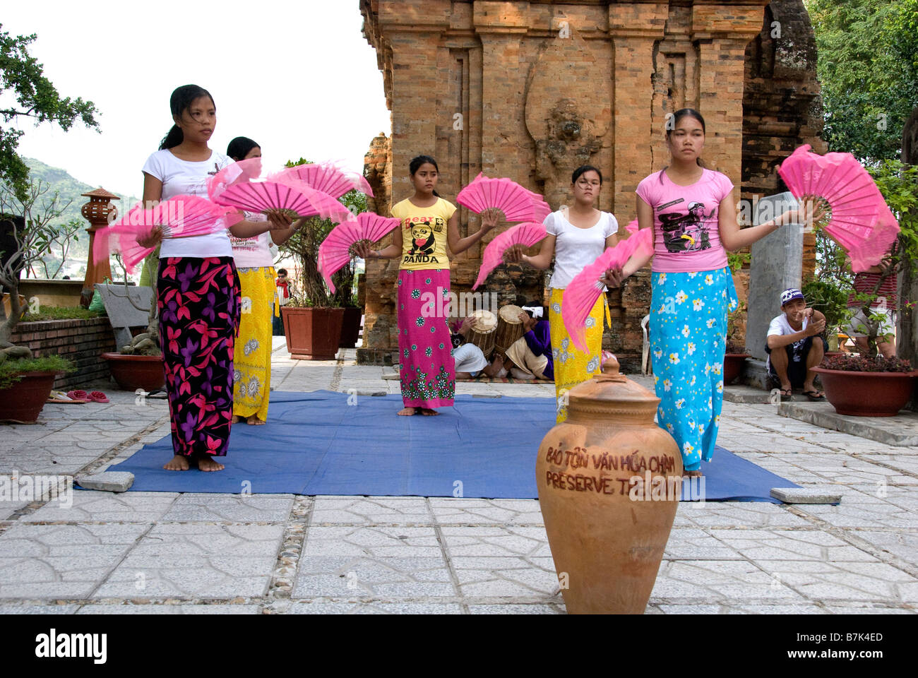Female Cham dancers performing to traditional Cham dances in an effort ...