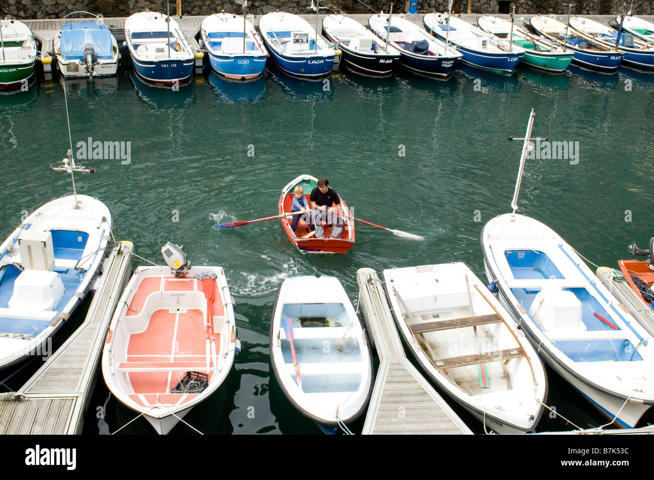 Boy rowing boat hi-res stock photography and images - Alamy