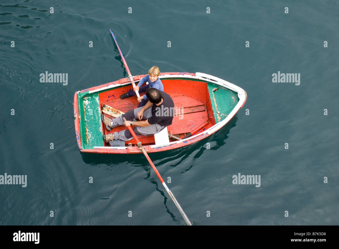 father and son in rowing boat, spain Stock Photo - Alamy