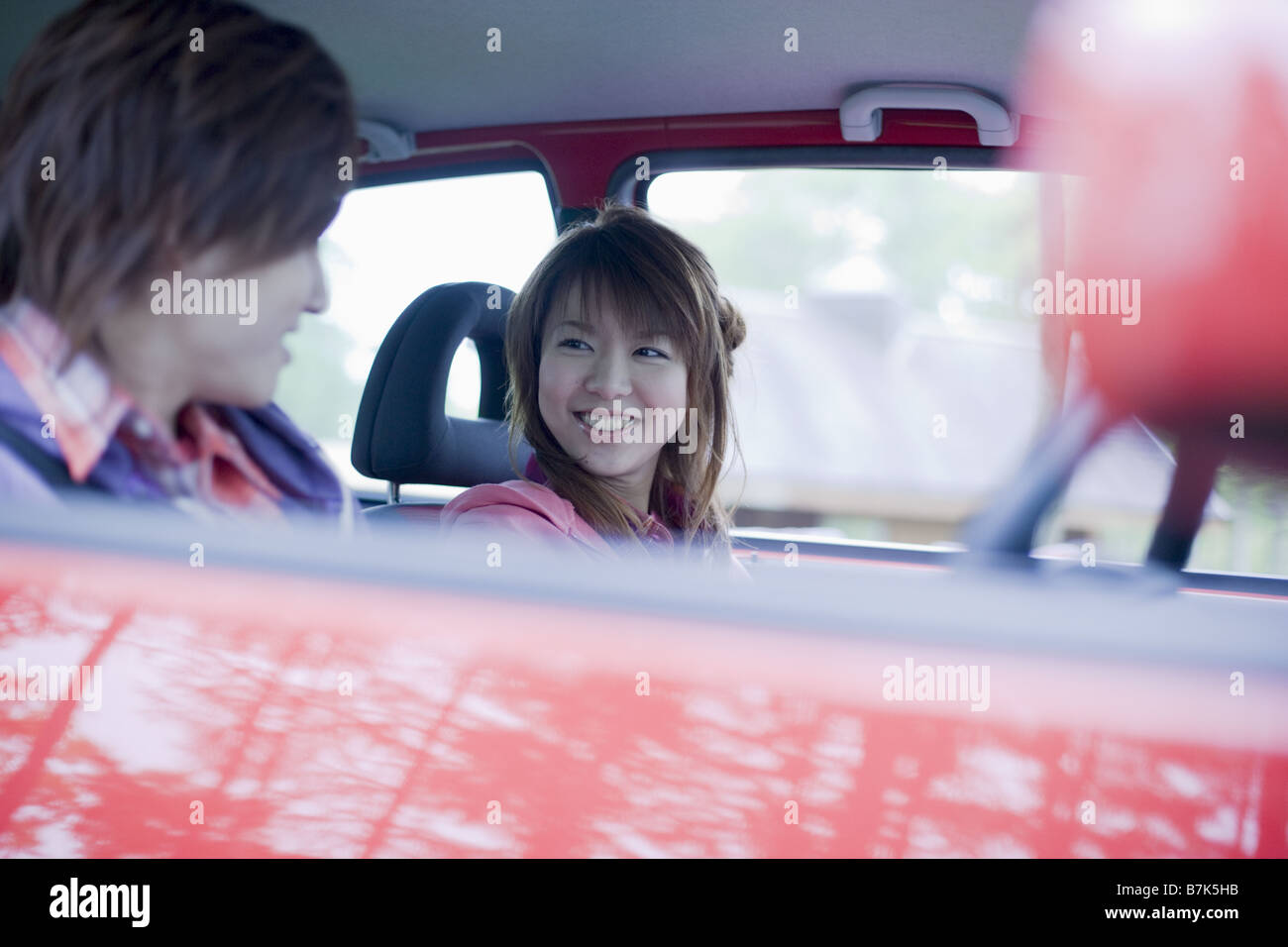 Two people in a car having a chat hi-res stock photography and images ...