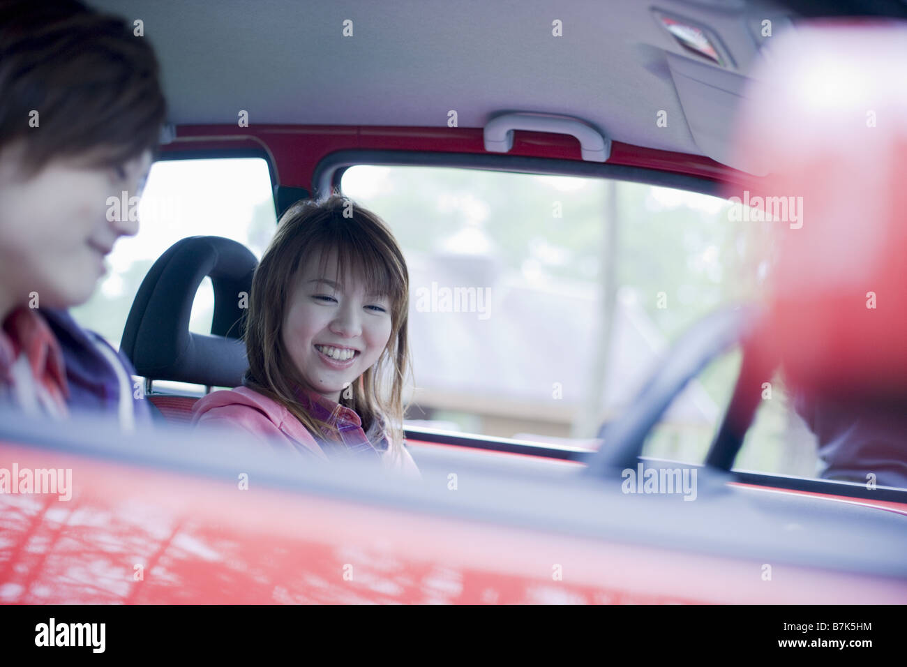 Young Couple Having Chat in a Car Stock Photo - Alamy