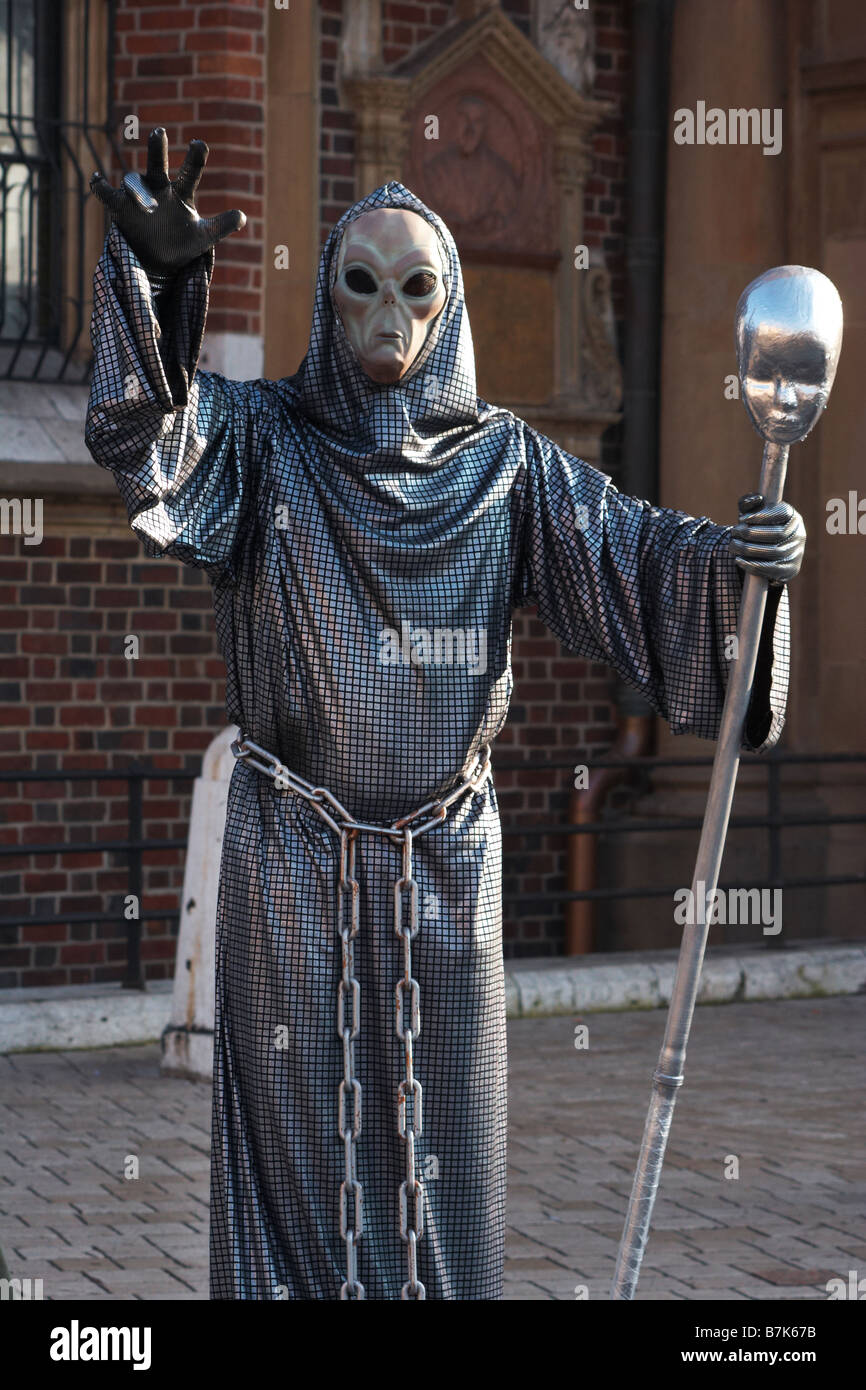 Silver painted street performer in hi-res stock photography and images ...