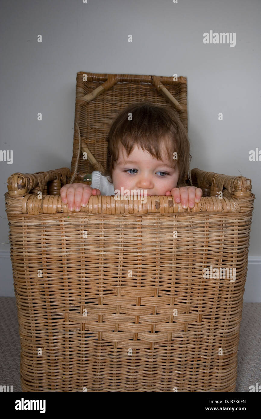 Baby hiding a toy hi-res stock photography and images - Alamy