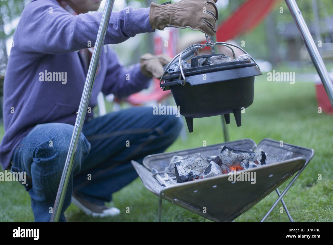 Man Holding Dutch Oven Stock Photo - Alamy