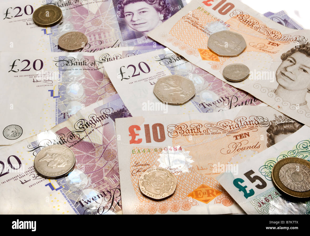 British currency with different value notes and coins Stock Photo - Alamy