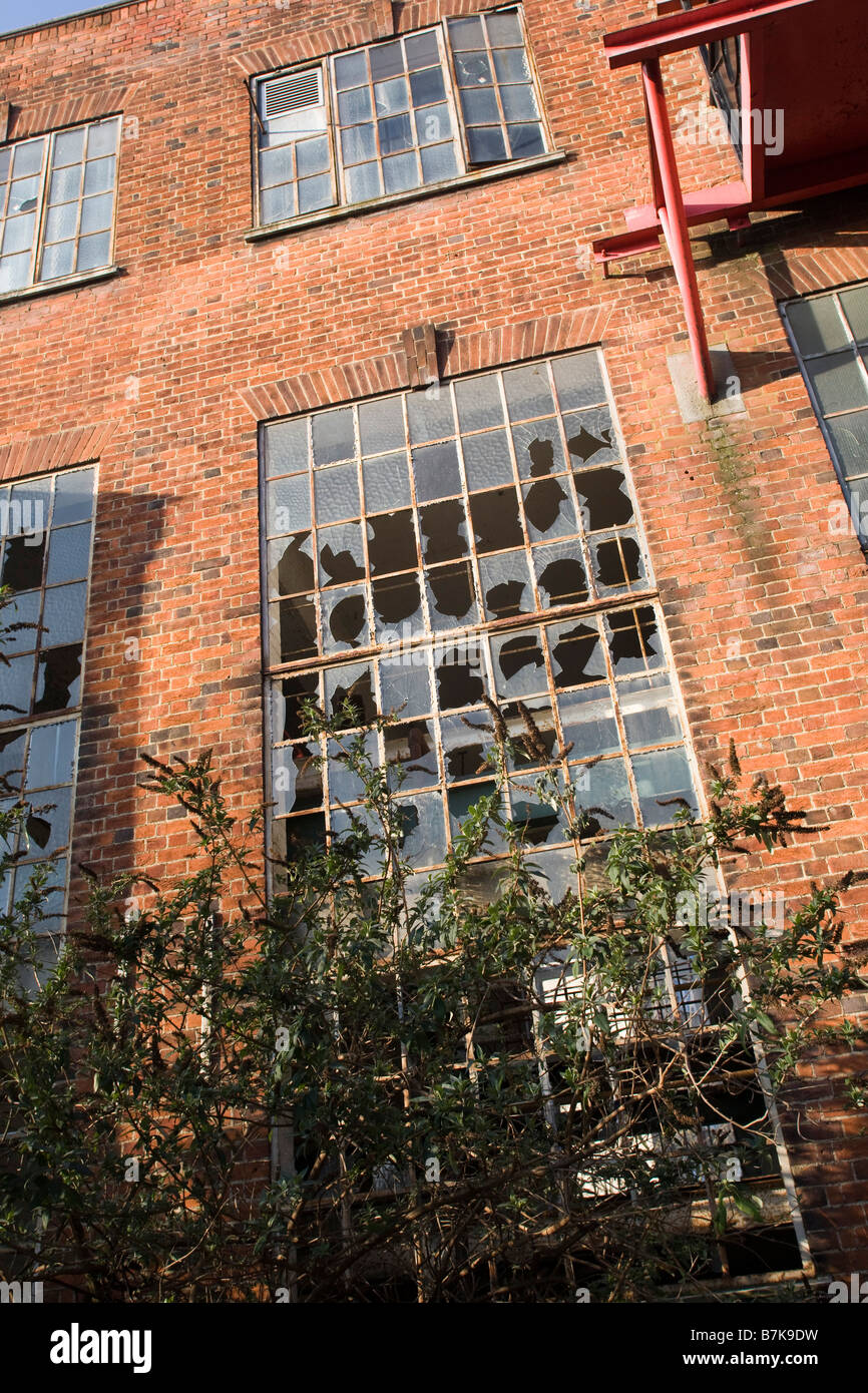 Shattered glass windows in derelict factory hi-res stock photography ...