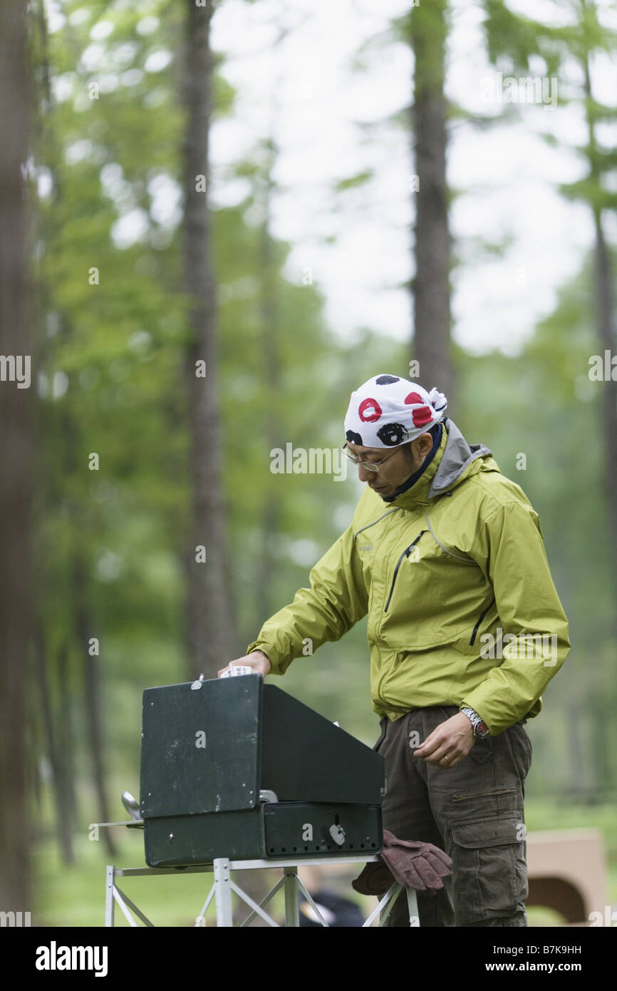 Man Making a Fire with Charcoal Stock Photo - Alamy