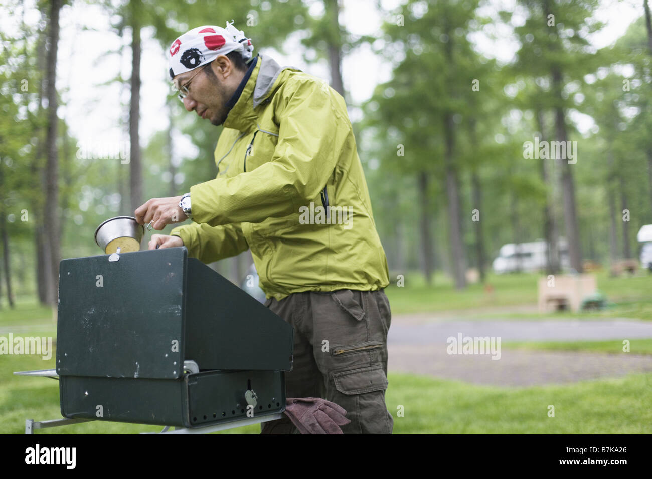 Man Making a Fire with Charcoal Stock Photo - Alamy