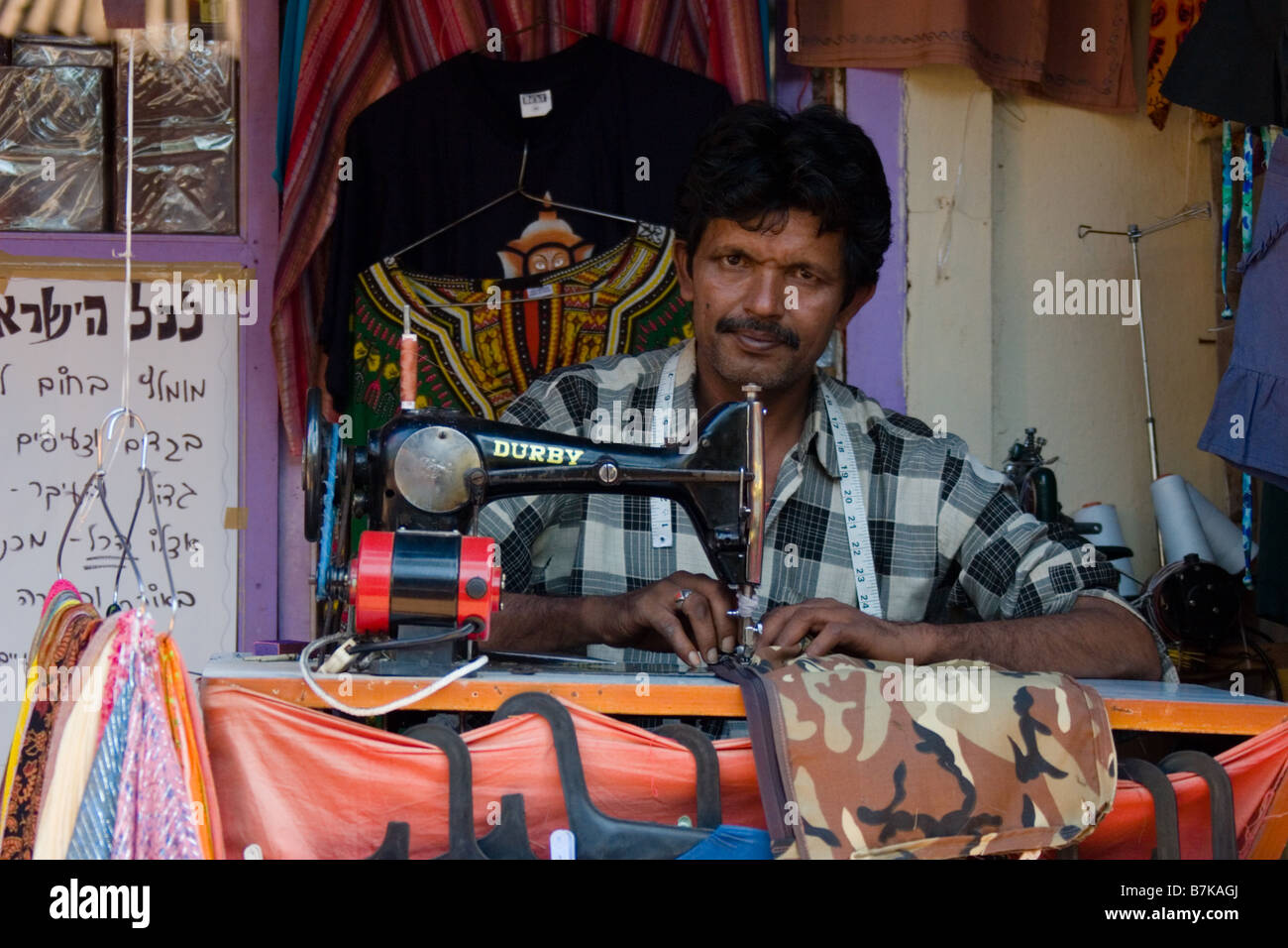 India, Goa. Tailor sew in mashine Stock Photo - Alamy