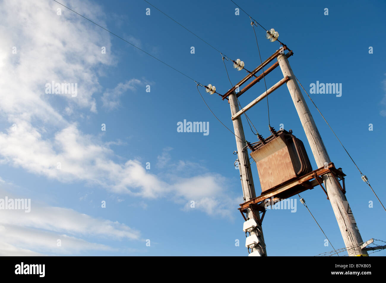 Electricity supply - electrical transformer on a pylon Stock Photo - Alamy