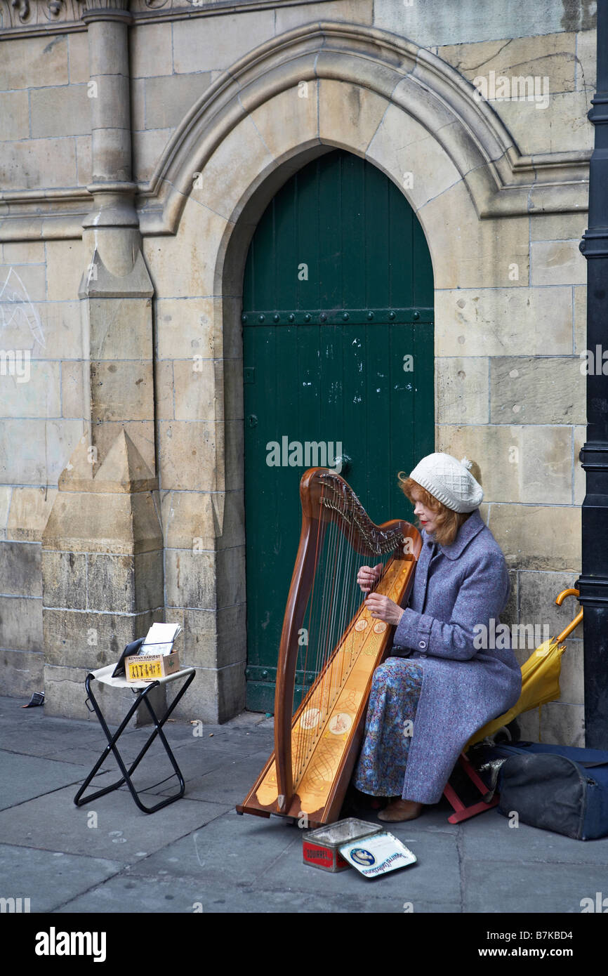 Redhaired woman playing Harp. Dublin, Ireland Stock Photo - Alamy