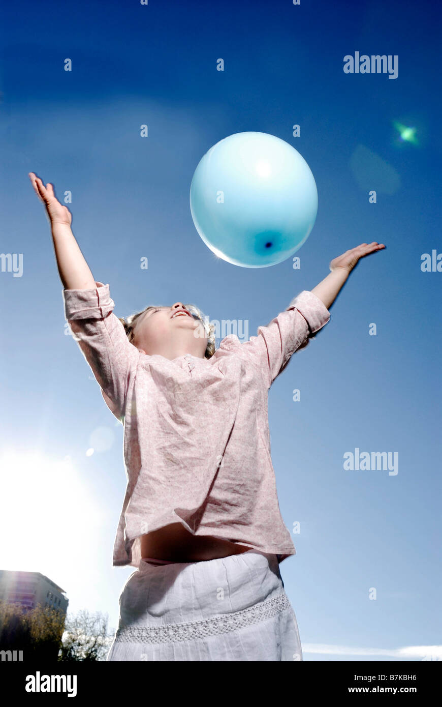3 years old girl throwing a balloon Stock Photo - Alamy