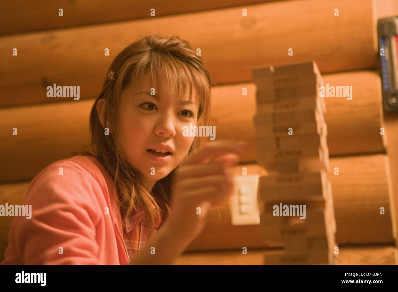 Young Woman Playing Jenga Stock Photo - Alamy