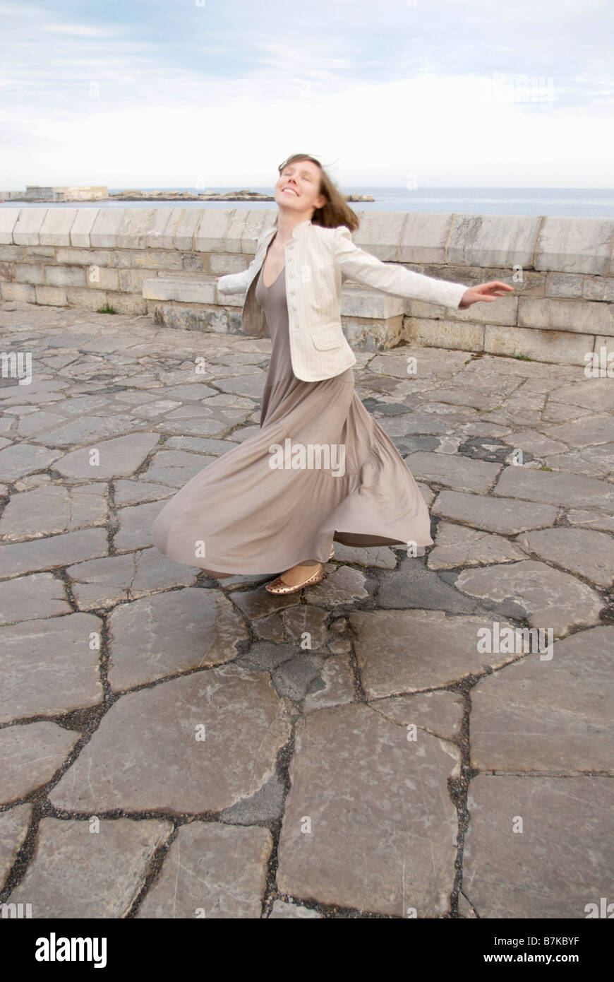 woman twirling skirt outside Stock Photo - Alamy