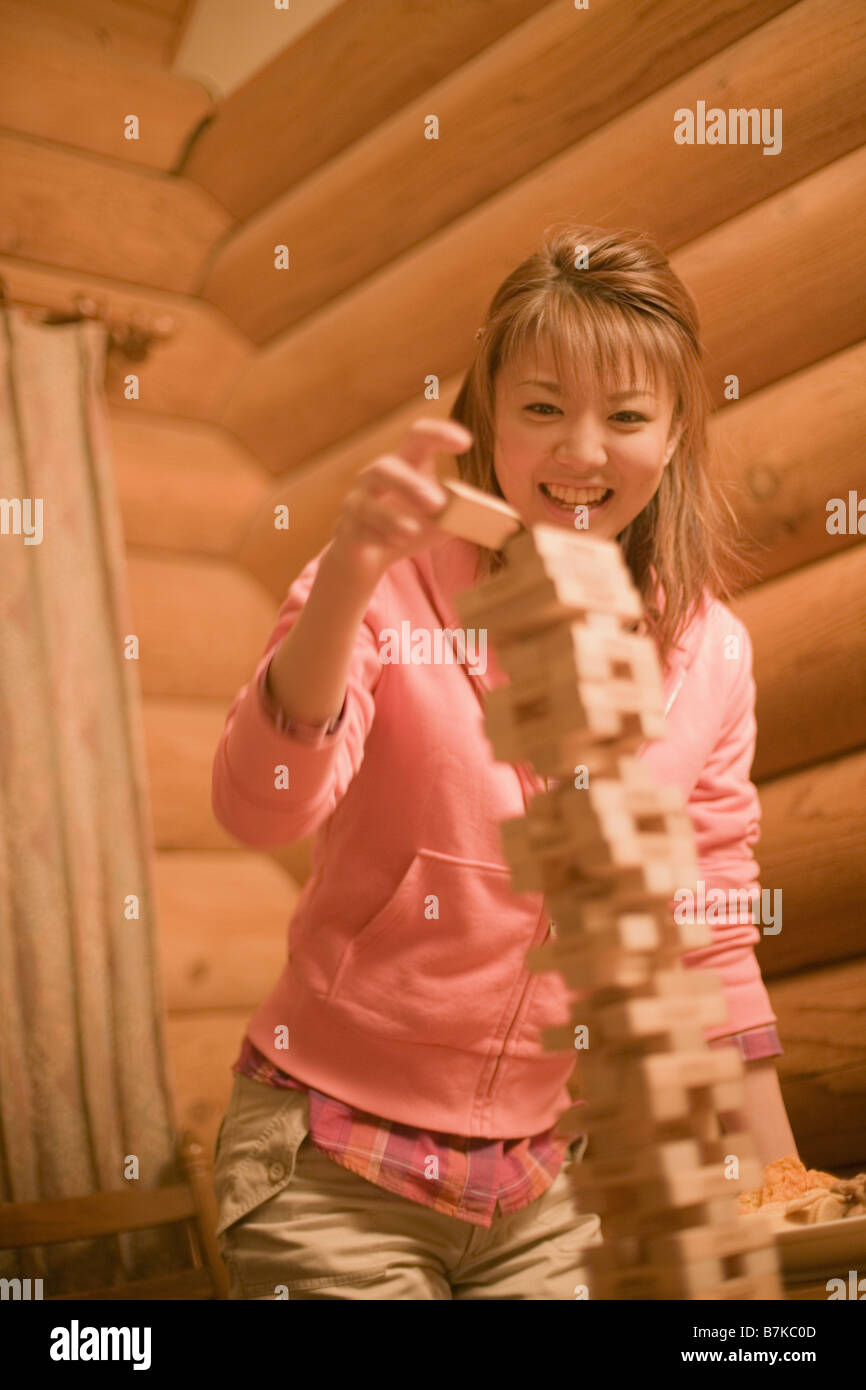 Woman playing jenga hi-res stock photography and images - Alamy