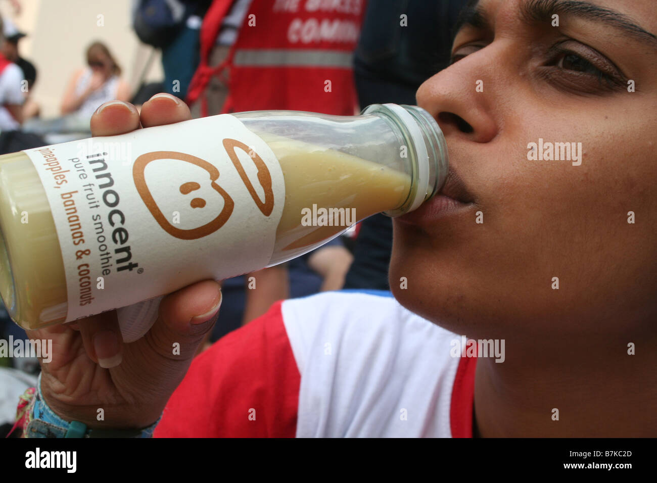 Women Drinking a Innocent Smoothie Fruit Drink Stock Photo - Alamy