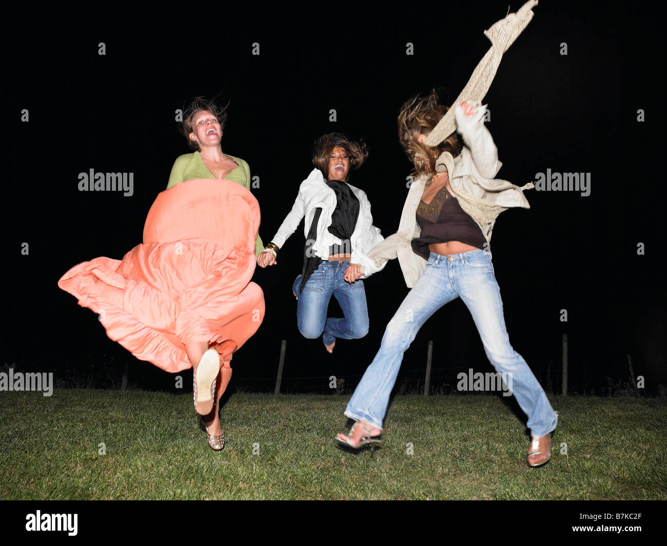 Woman dancing in the dark Stock Photo - Alamy