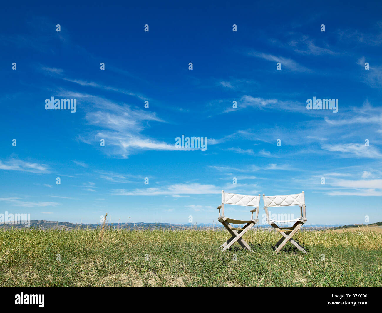 Two seats in front of landscape Stock Photo - Alamy
