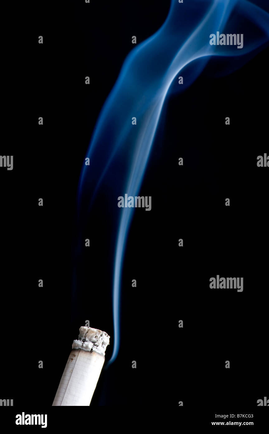 object on black cigarette with smoke Stock Photo - Alamy