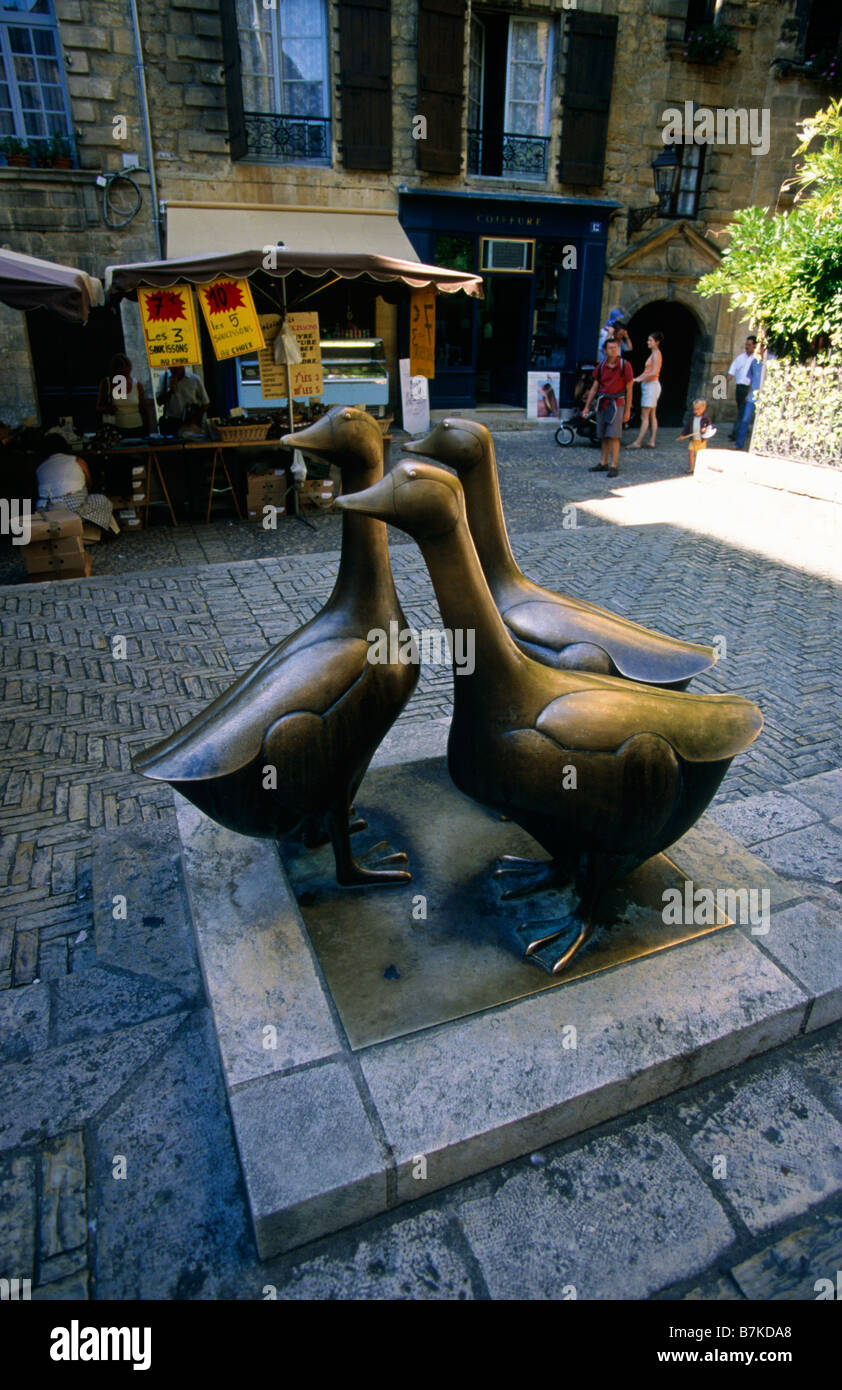 Medieval market town Place des Oies Three bronze sculptures of geese ...