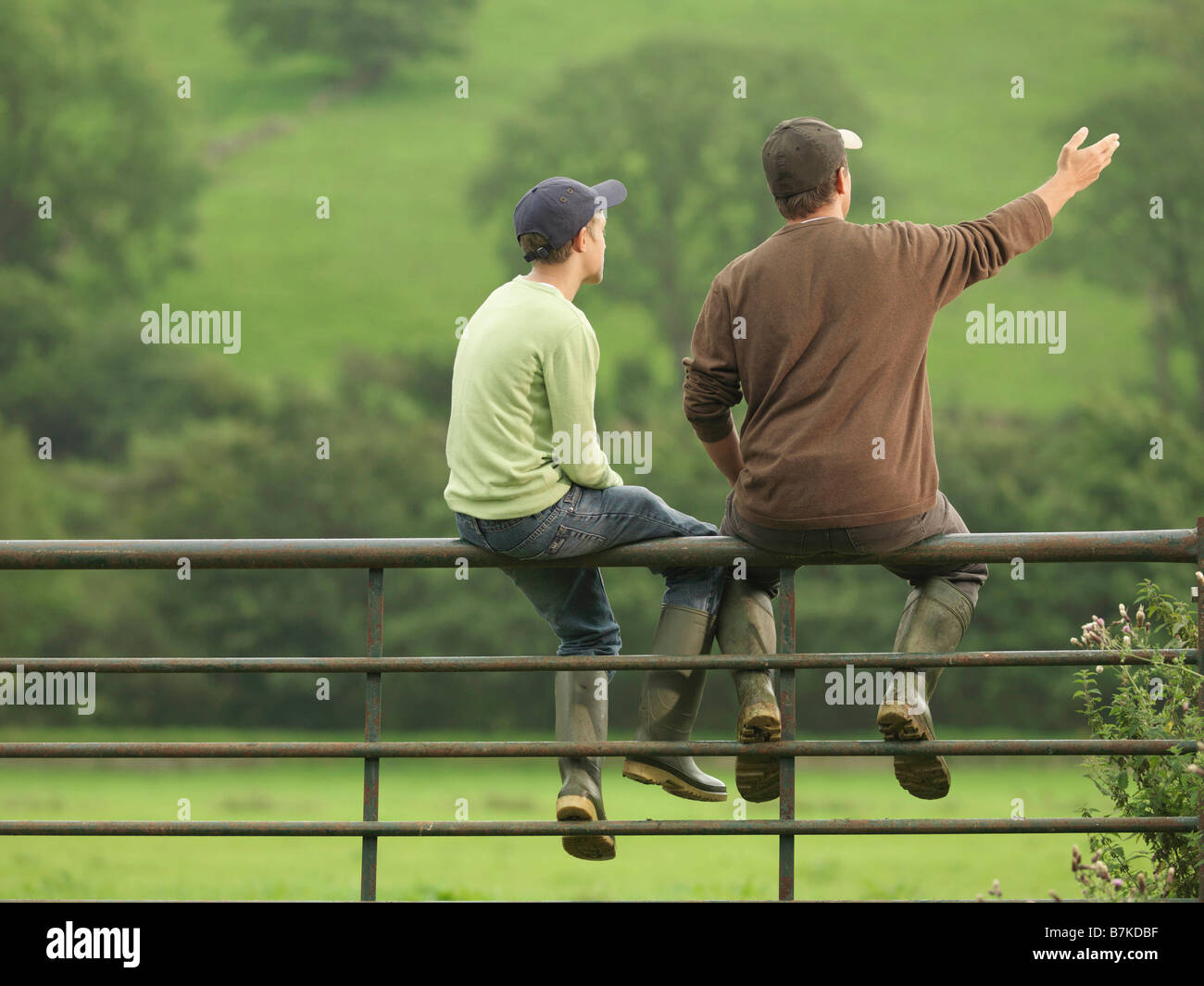 Two people fence talking hi-res stock photography and images - Alamy