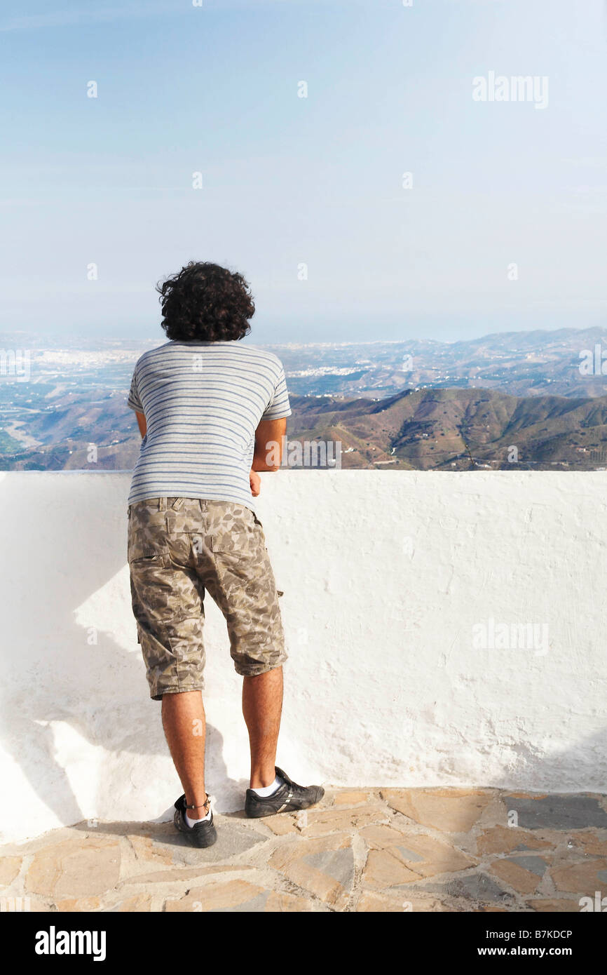 Man looking at a view Stock Photo - Alamy