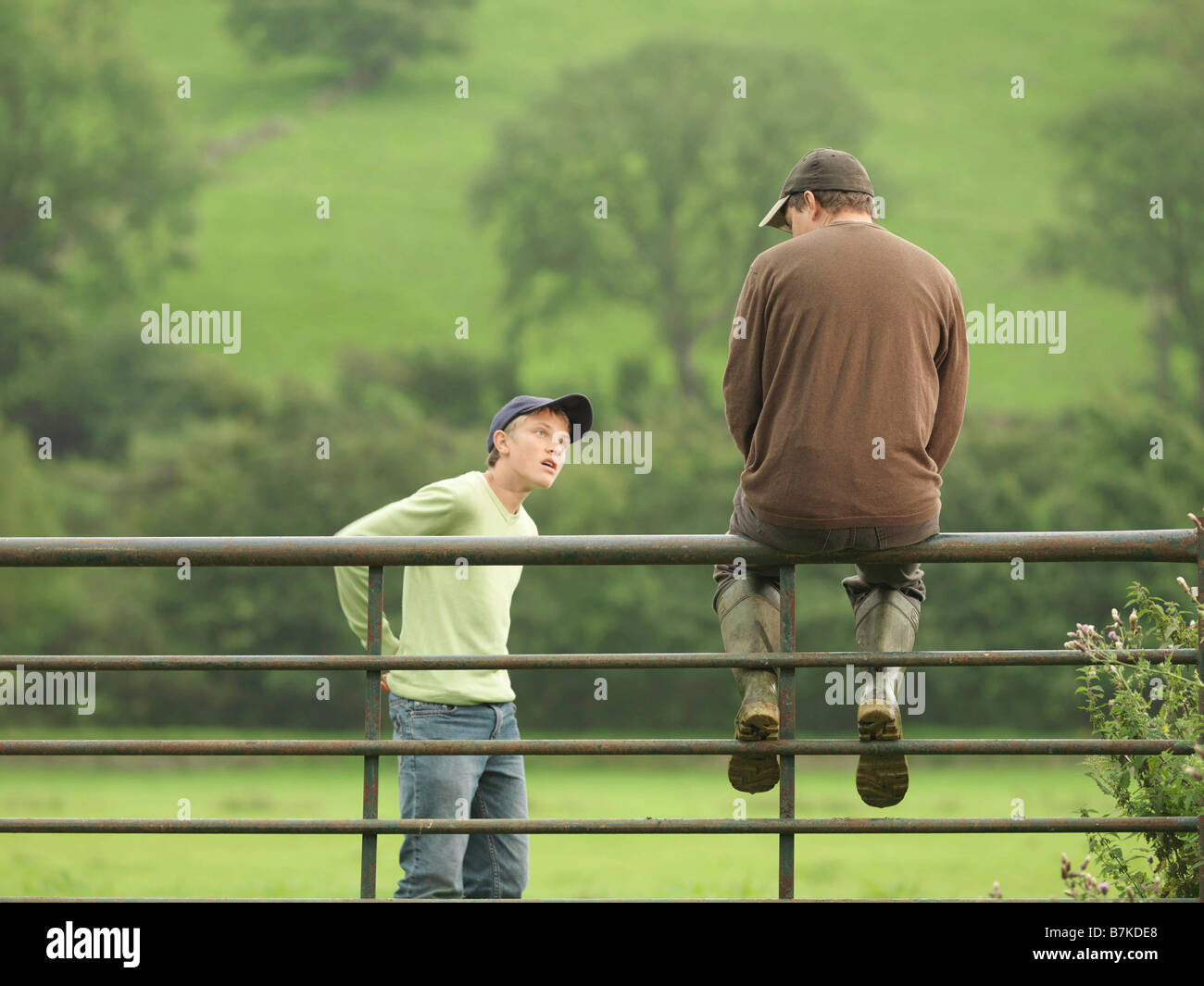 Two people fence talking hi-res stock photography and images - Alamy