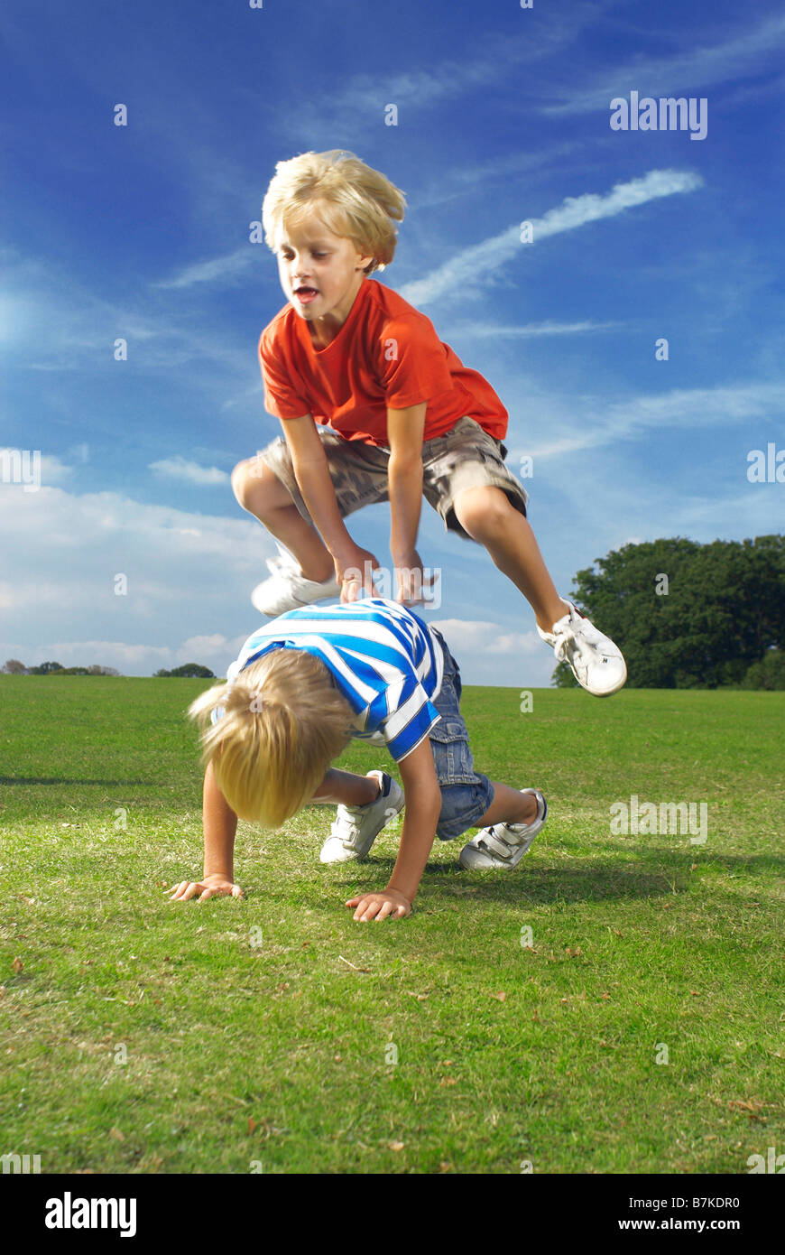 Two children playing leapfrog hi-res stock photography and images - Alamy