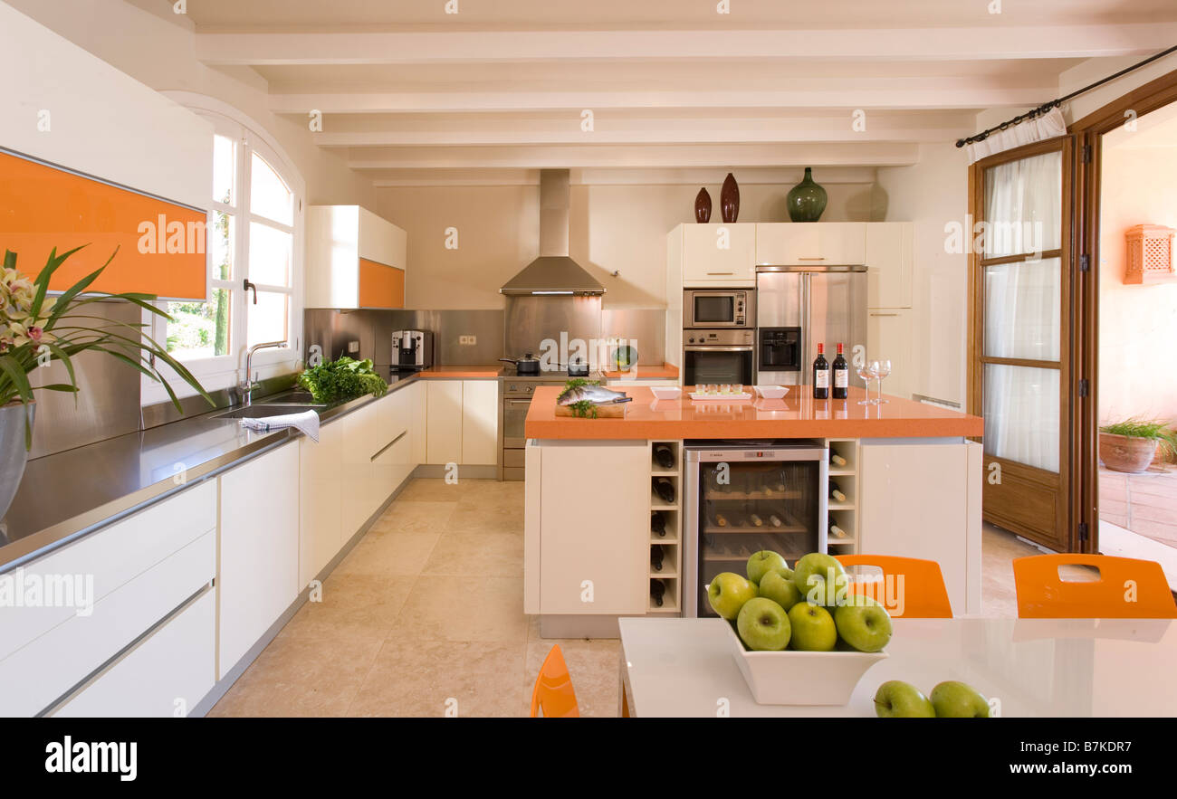 Modern kitchen with large island unit providing wine storage Stock ...