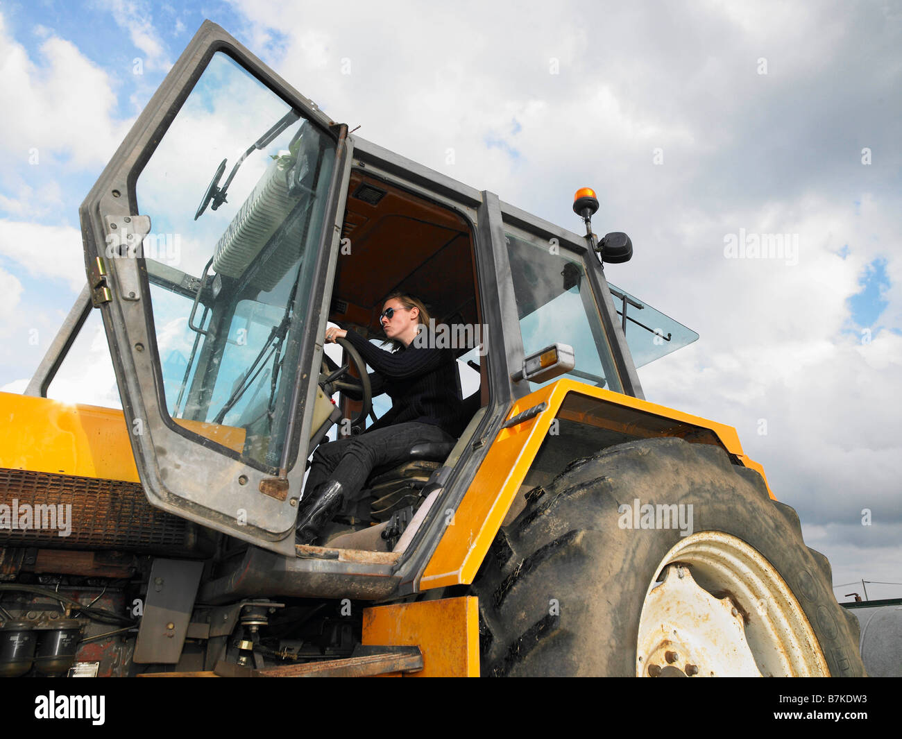 woman driving tractor Stock Photo - Alamy