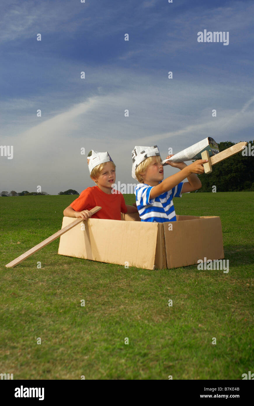 boys in box pretending to be boat Stock Photo - Alamy