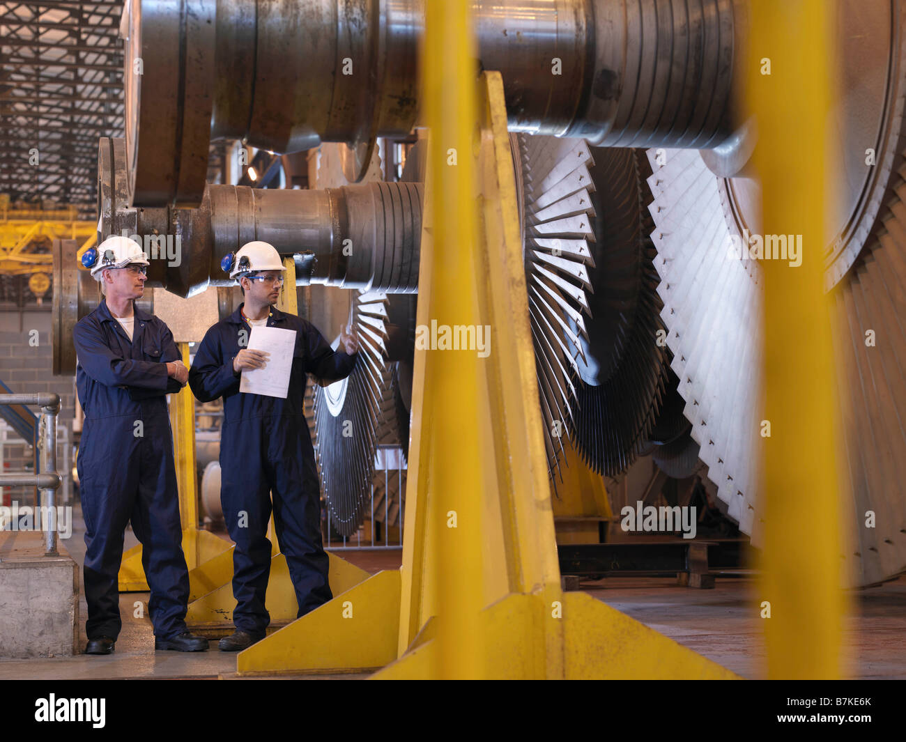 Industry examining watching holding expertise hi-res stock photography ...