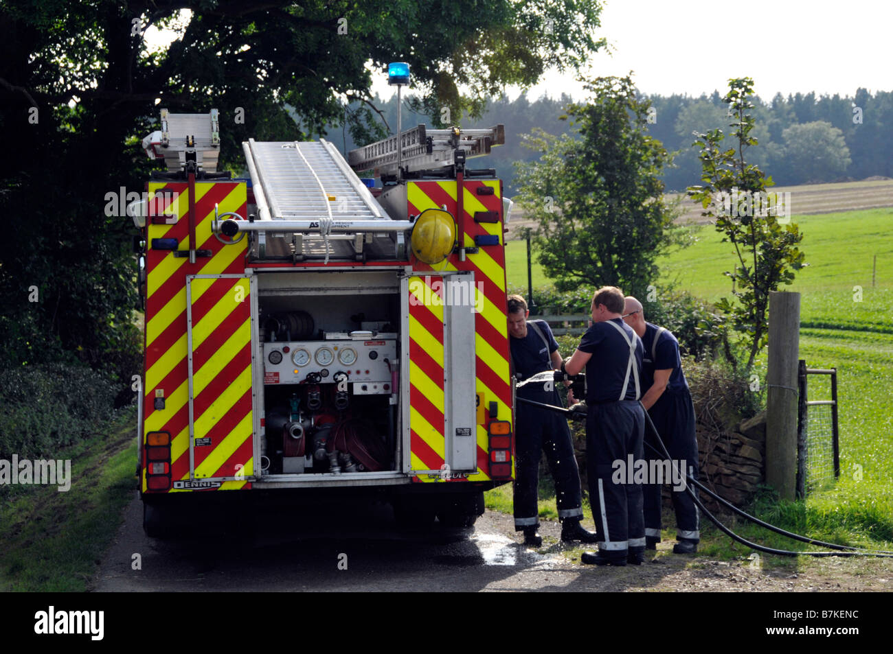Fire engine attending fire in a farmers field Derbyshire England UK ...