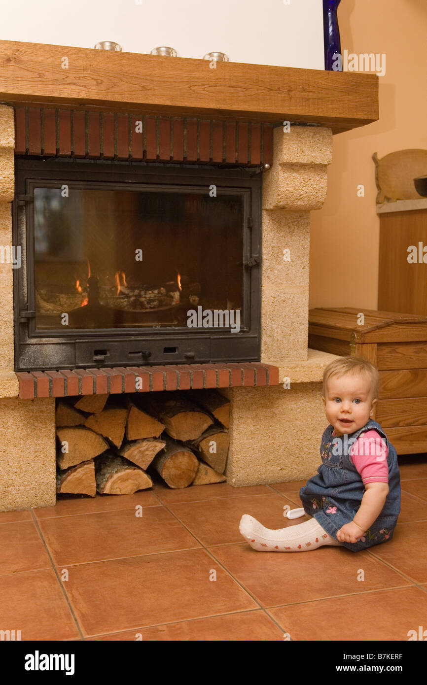 Eight Month Old Baby Sitting on Stone Floor Stock Photo - Alamy