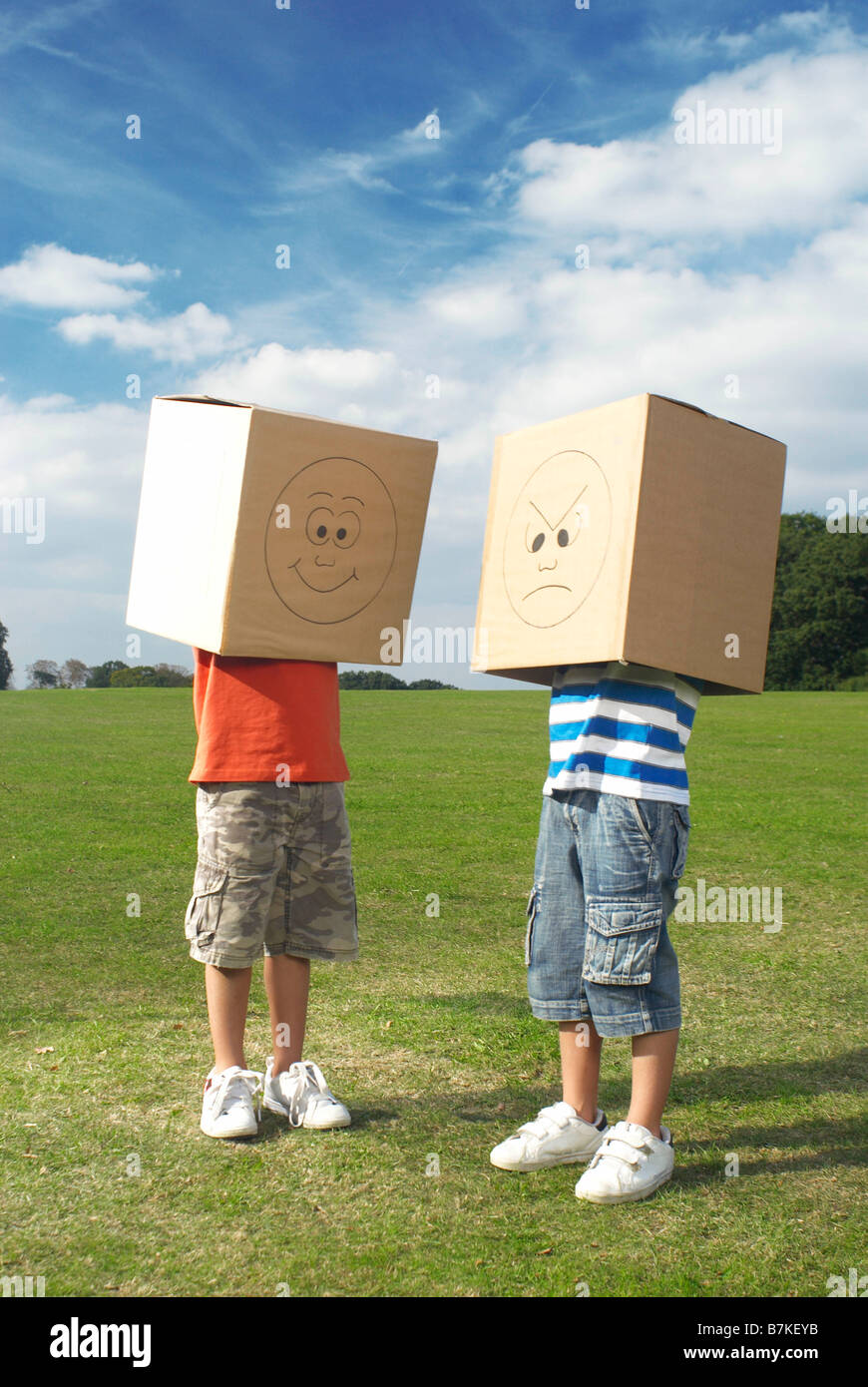 boys with boxes over heads Stock Photo - Alamy