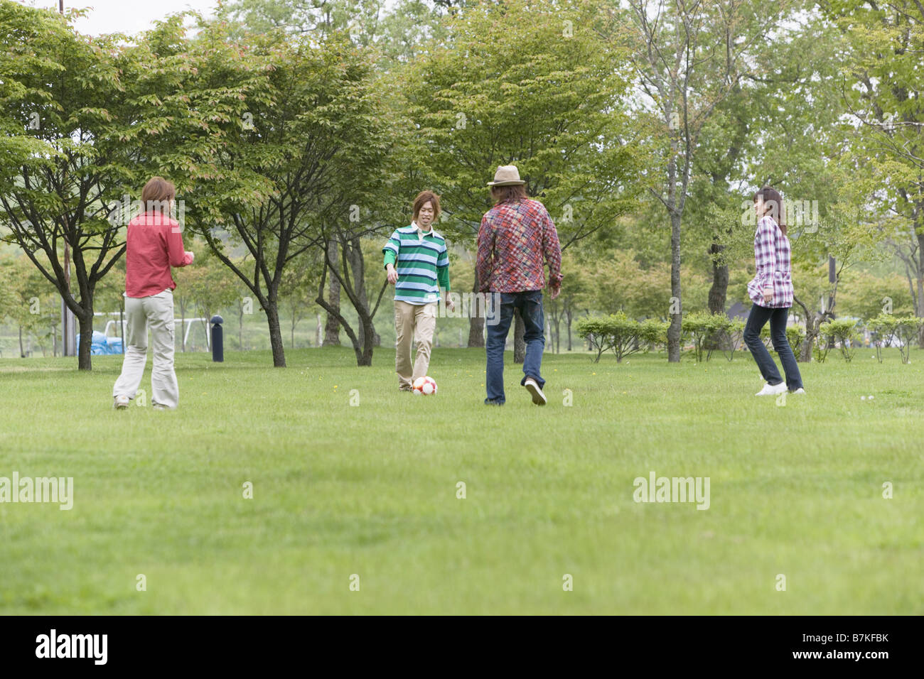 Group of Young People Playing Soccer Stock Photo - Alamy