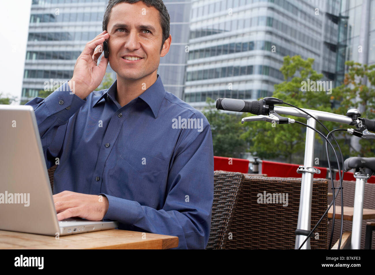 Man working on laptop outside Stock Photo - Alamy
