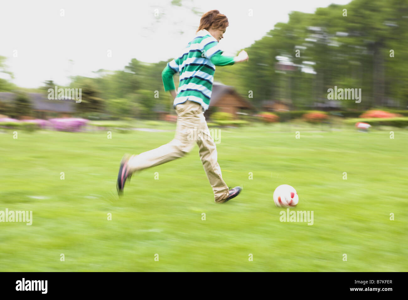 Young Man Playing Soccer Stock Photo - Alamy