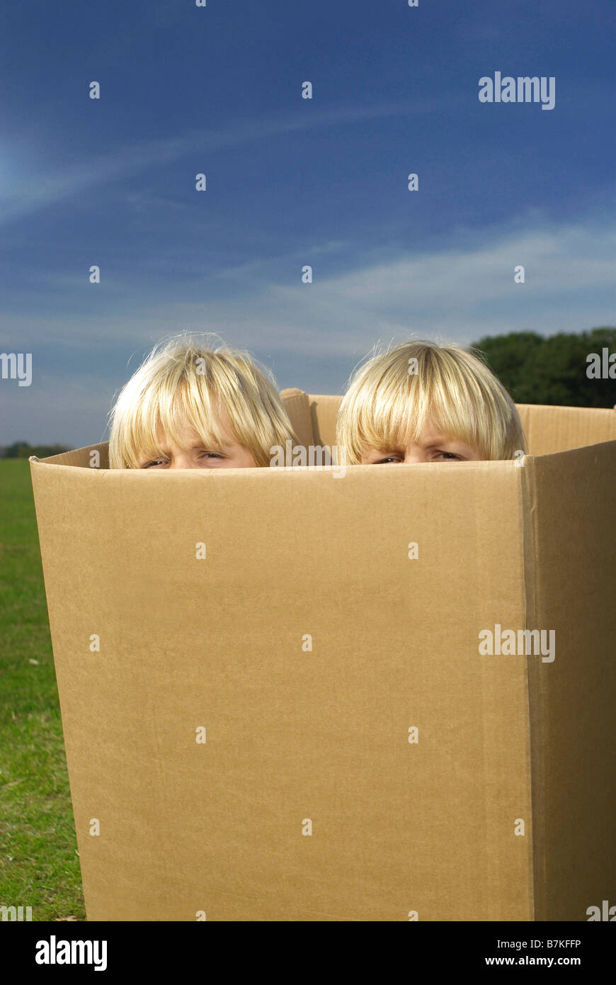 boys looking out of box Stock Photo - Alamy
