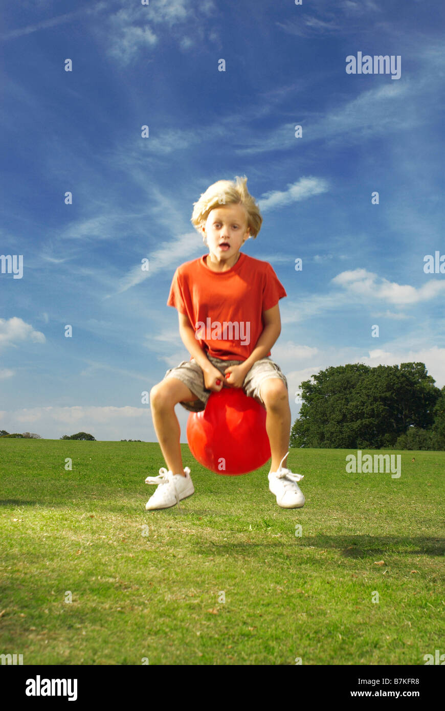 Child on space hopper hi-res stock photography and images - Alamy