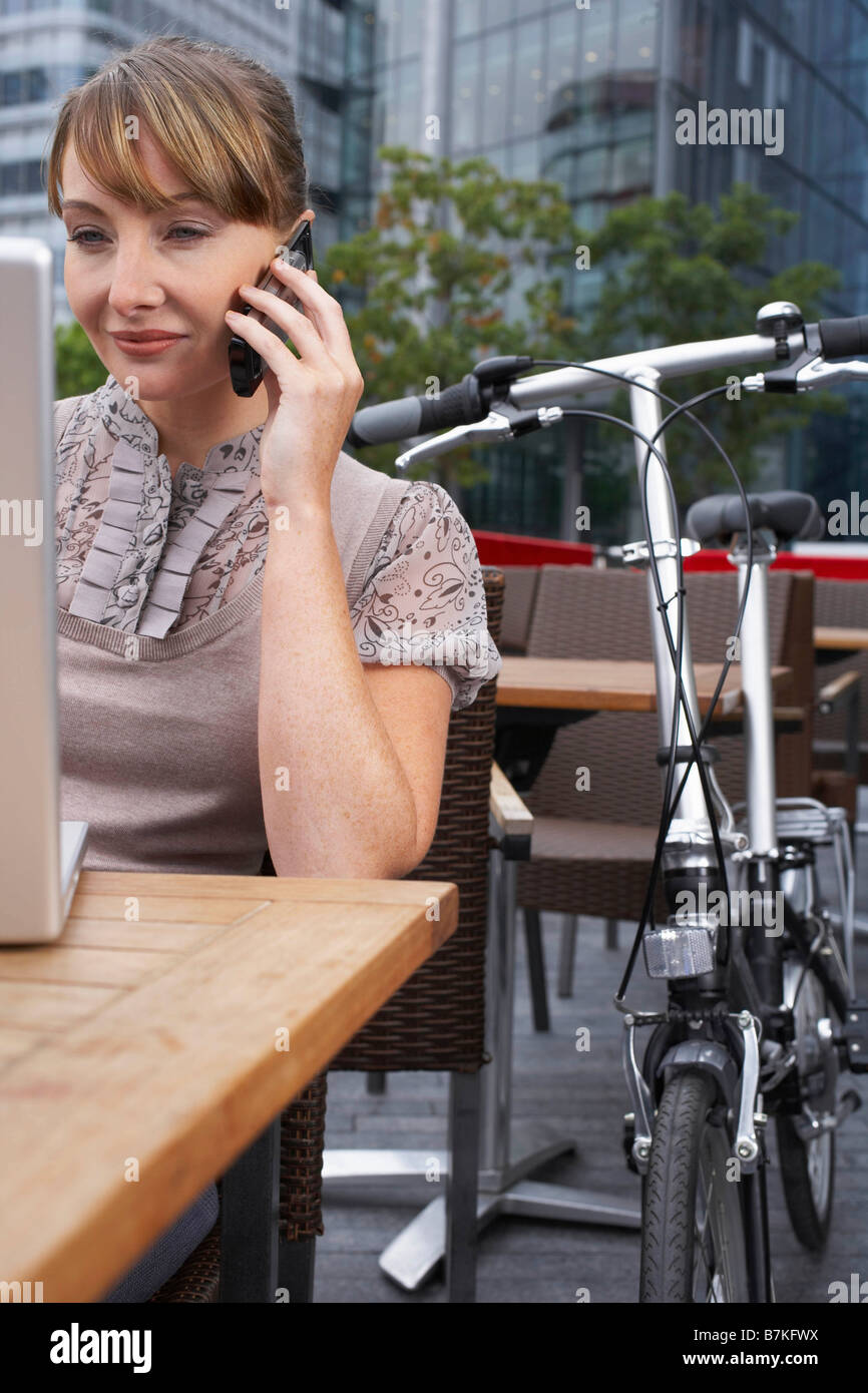 Business woman using mobile outside Stock Photo - Alamy
