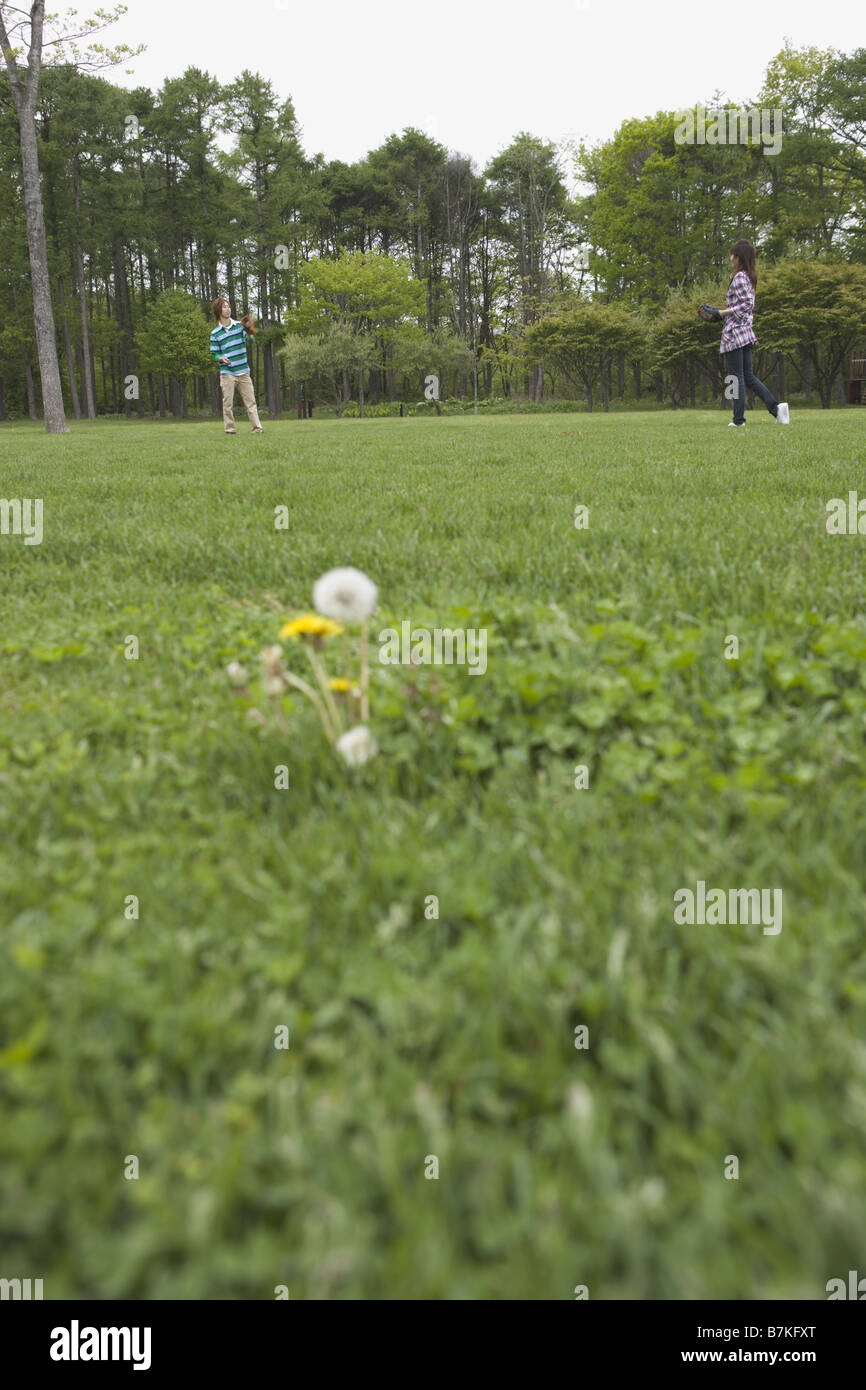 Young Couple Playing Catch Stock Photo - Alamy