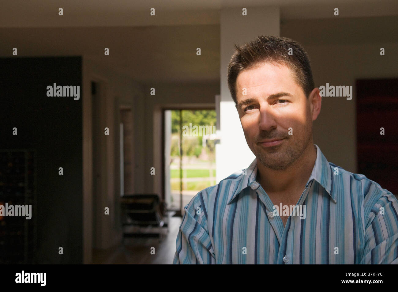A portrait of a man in shaded light Stock Photo - Alamy