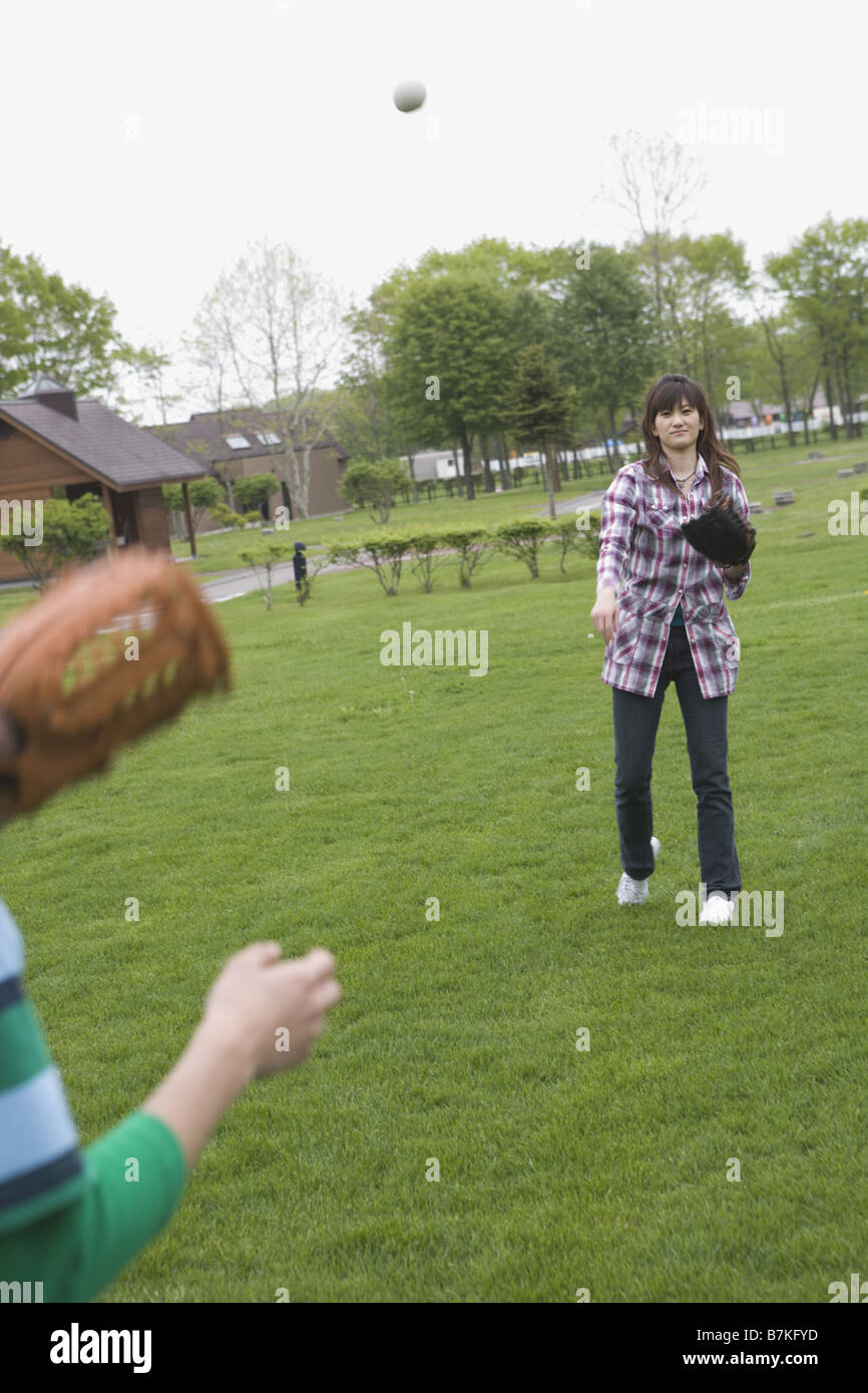 Young Couple Playing Catch Stock Photo - Alamy