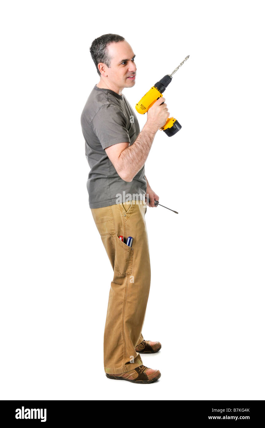 Confident handyman holding a drill and screwdriver Stock Photo - Alamy